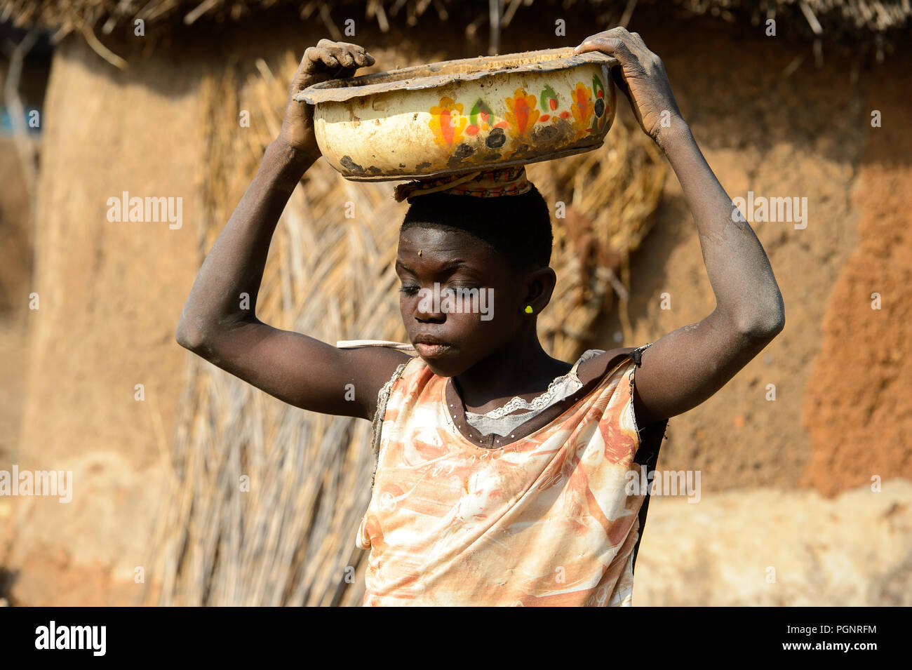 GHANI, GHANA - JAN 14, 2017: Unidentified Ghanaian woman carries a ...