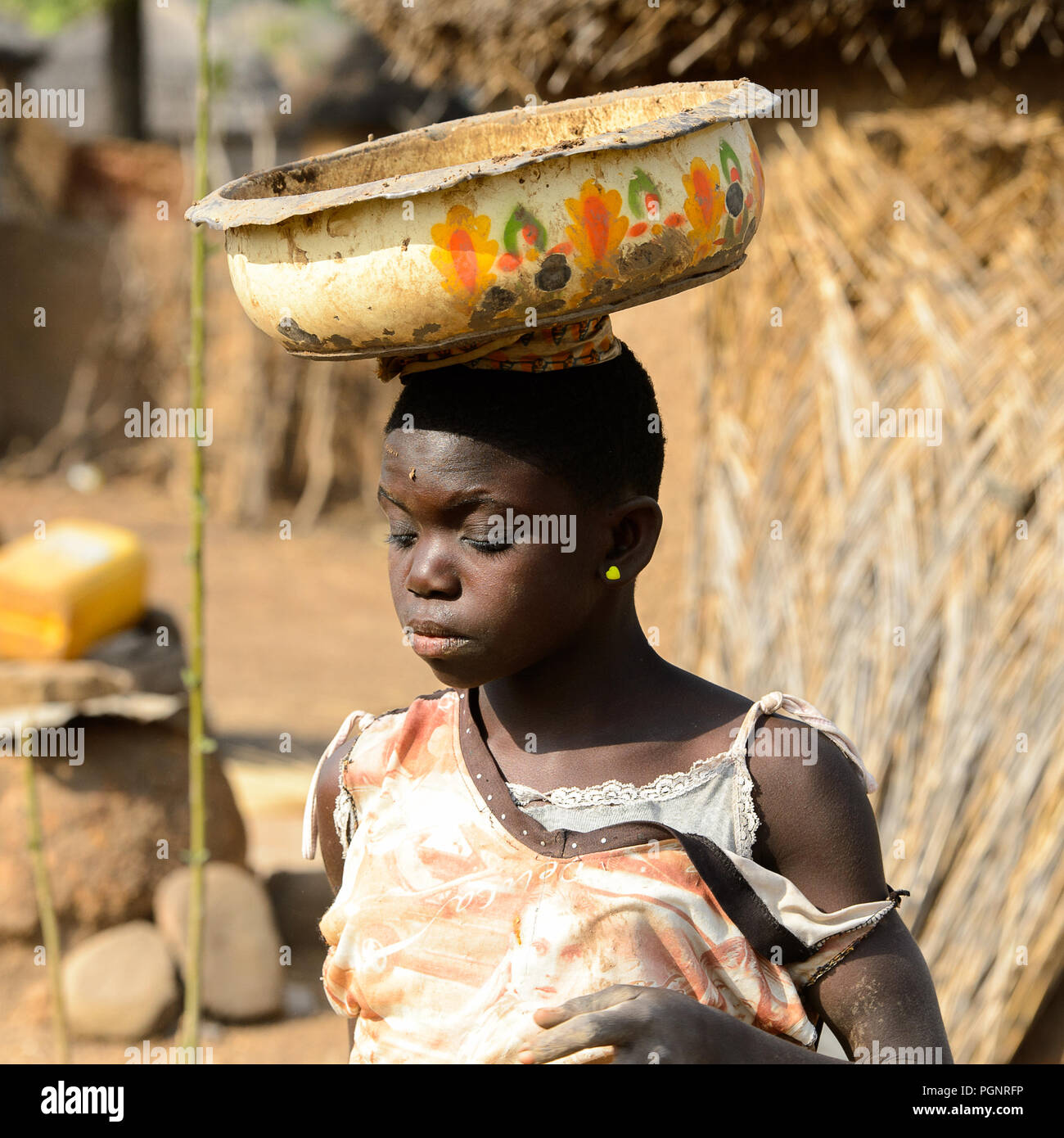 GHANI, GHANA - JAN 14, 2017: Unidentified Ghanaian woman carries a ...