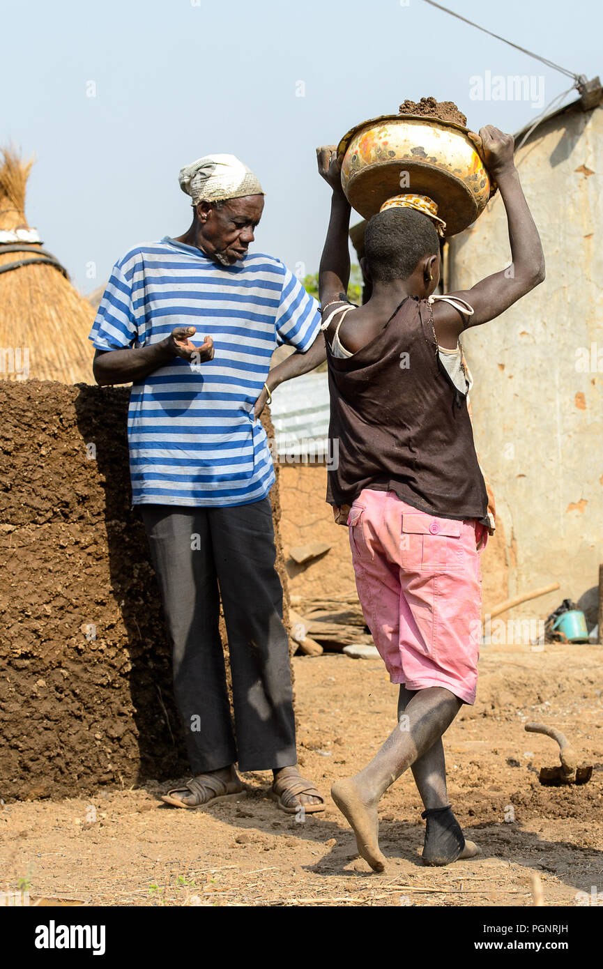 GHANI, GHANA - JAN 14, 2017: Unidentified Ghanaian girl carries a basin ...