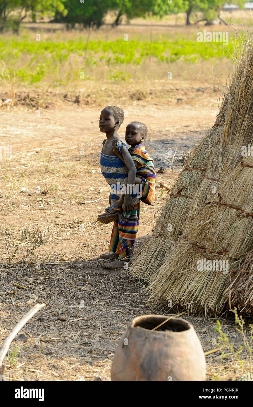 GHANI, GHANA - JAN 14, 2017: Unidentified Ghanaian little girl carries ...