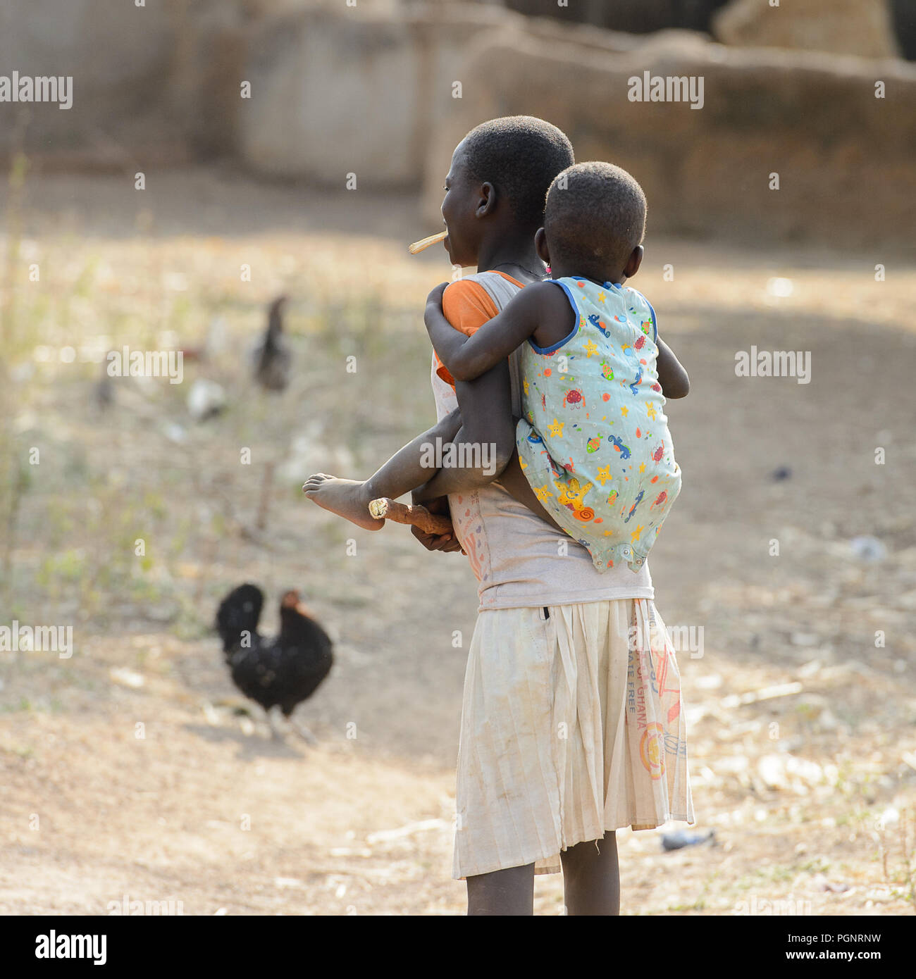GHANI, GHANA - JAN 14, 2017: Unidentified Ghanaian little girl carries ...