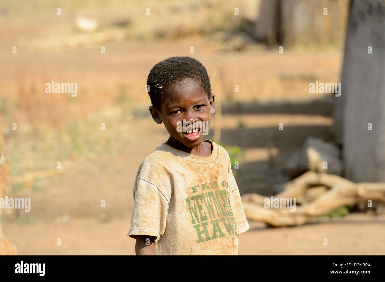 GHANI, GHANA - JAN 14, 2017: Unidentified Ghanaian little boy opens his ...