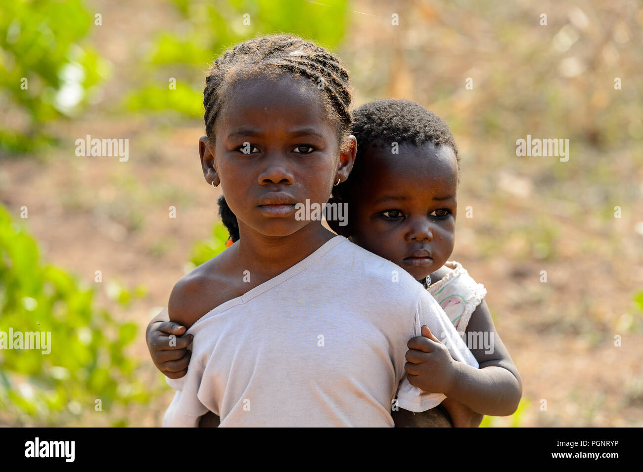 GHANI, GHANA - JAN 14, 2017: Unidentified Ghanaian little girl carries ...