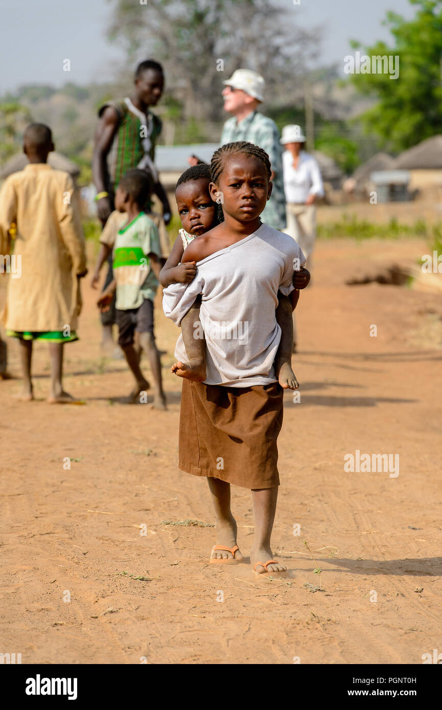 GHANI, GHANA - JAN 14, 2017: Unidentified Ghanaian little girl carries ...