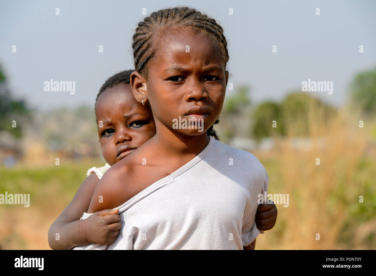 GHANI, GHANA - JAN 14, 2017: Unidentified Ghanaian little girl carries ...