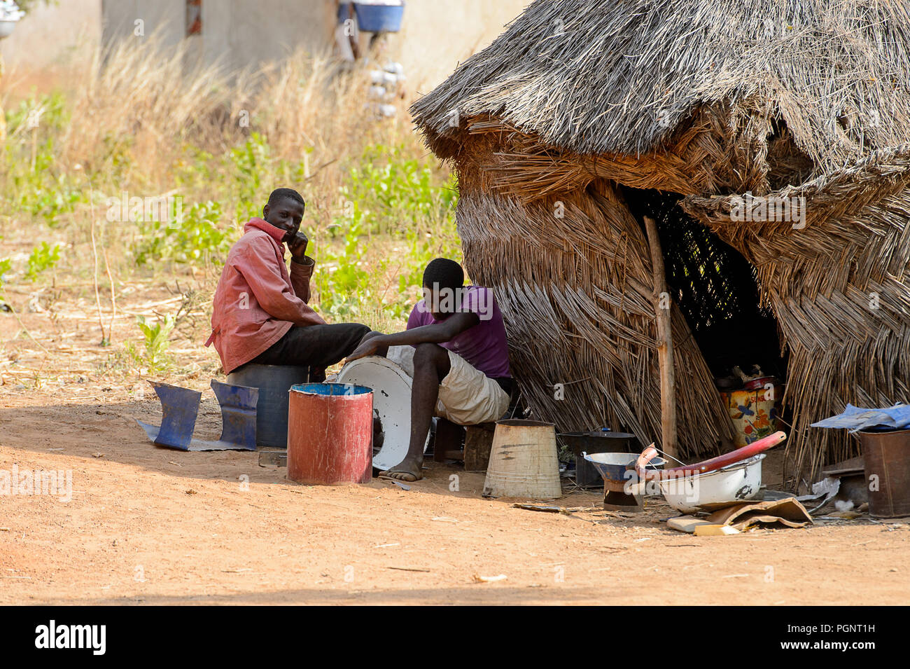 GHANI, GHANA - JAN 14, 2017: Unidentified Ghanaian people sit near the ...