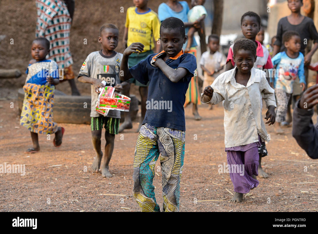 DAGOMBA VILLAGE, GHANA - JAN 14, 2017: Unidentified Dagomban boys walk ...