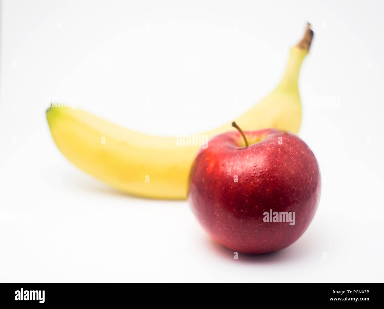 Apple and banana isolated Stock Photo - Alamy