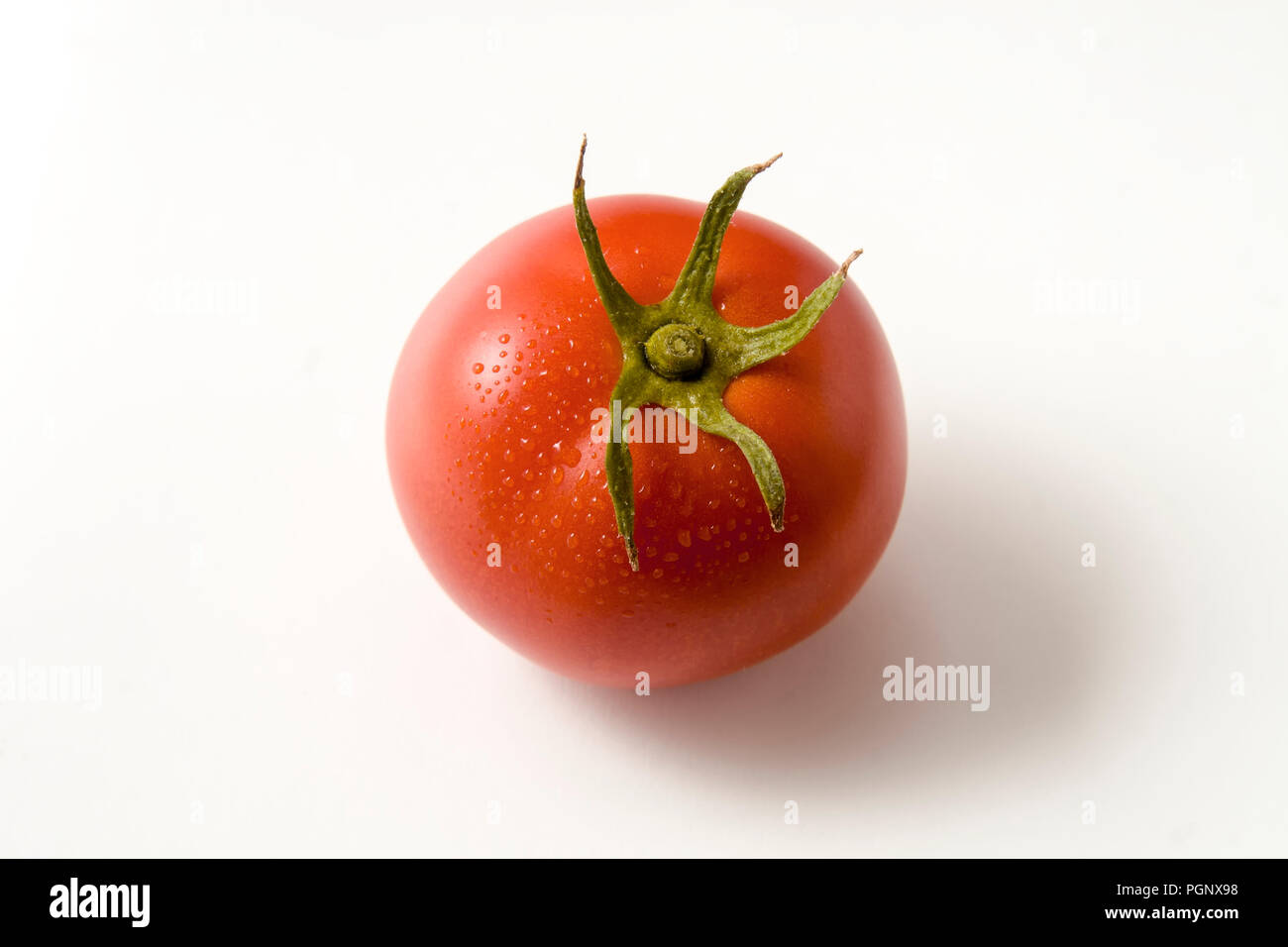 Single Tomato with Stem Isolated on White Background. Top view. Tomato ...