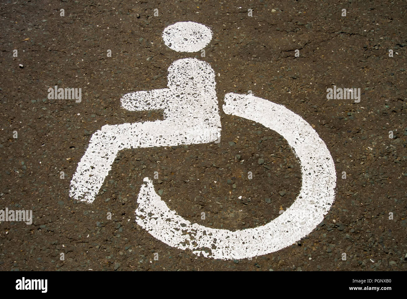 White disabled parking sign on the road Stock Photo - Alamy