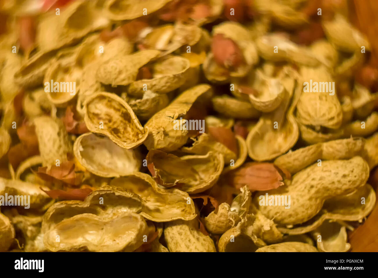 Peanuts and shells food background texture. Shallow dof Stock Photo - Alamy
