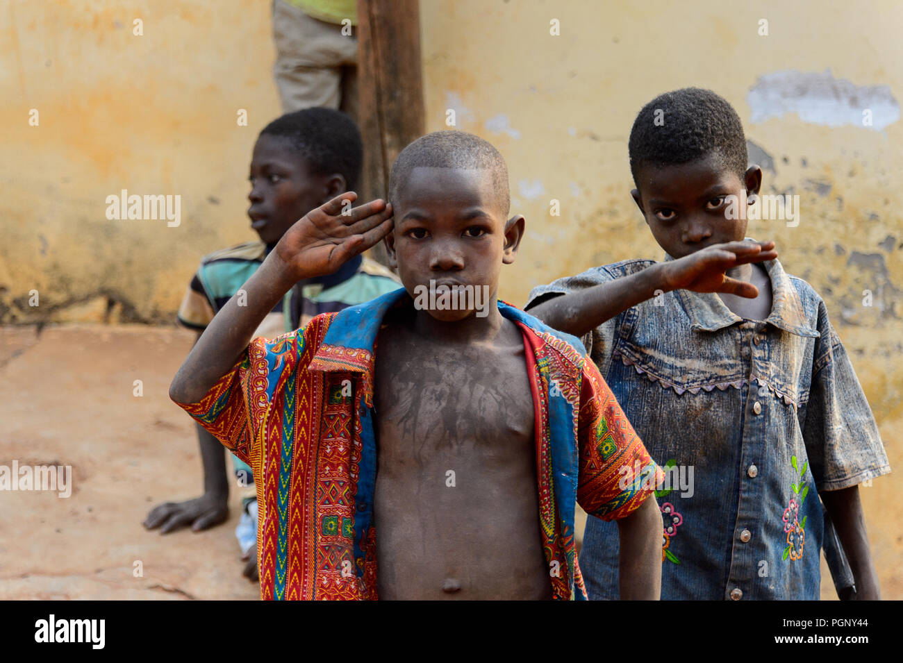 BOABENG, GHANA - JAN 15, 2017: Unidentified Ghanaian boy raiseshis hand ...