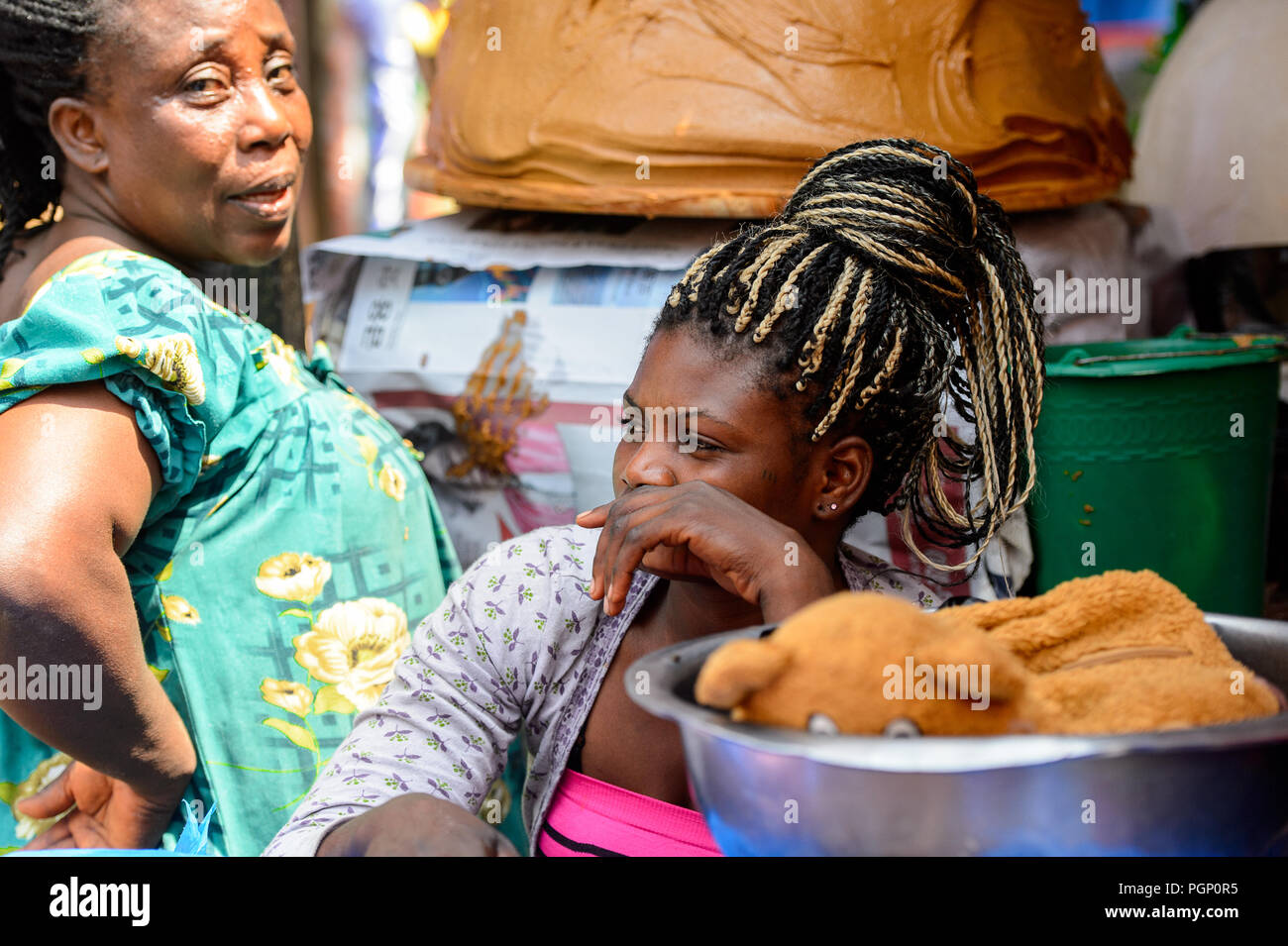 KUMASI, GHANA - JAN 15, 2017: Unidentified Ghanaian woman with braids ...