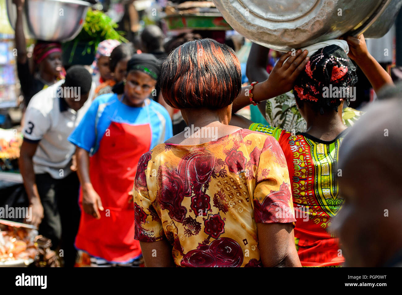 KUMASI, GHANA - JAN 15, 2017: Unidentified Ghanaian woman from behind ...