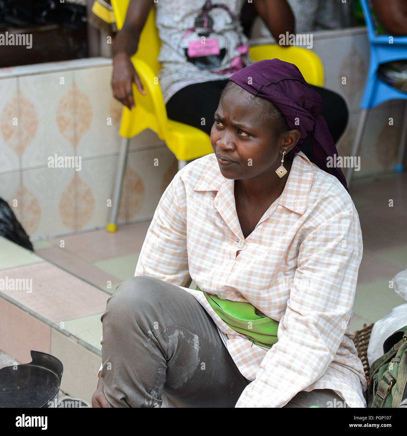 KUMASI, GHANA - JAN 15, 2017: Unidentified Ghanaian woman sits at the ...