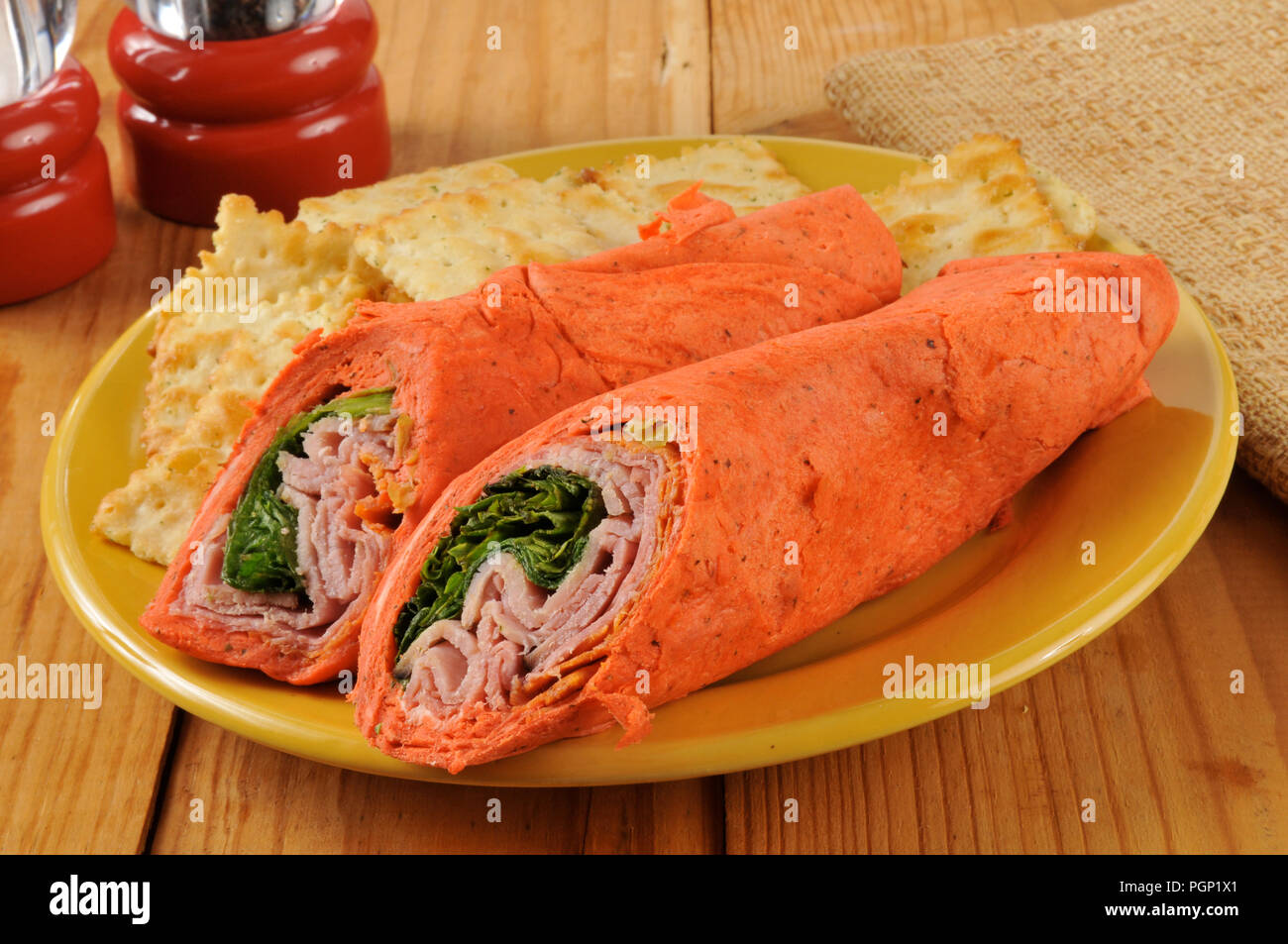 Italian style wrap sandwich with ham, pepporoni, and romaine lettuce ...