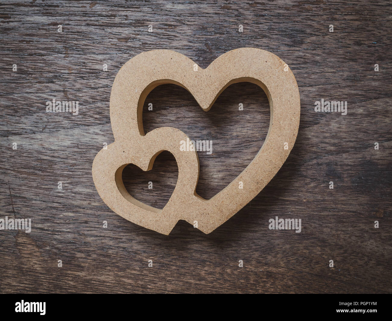 Wooden twin hearts on old wooden texture background. Love concept Stock ...