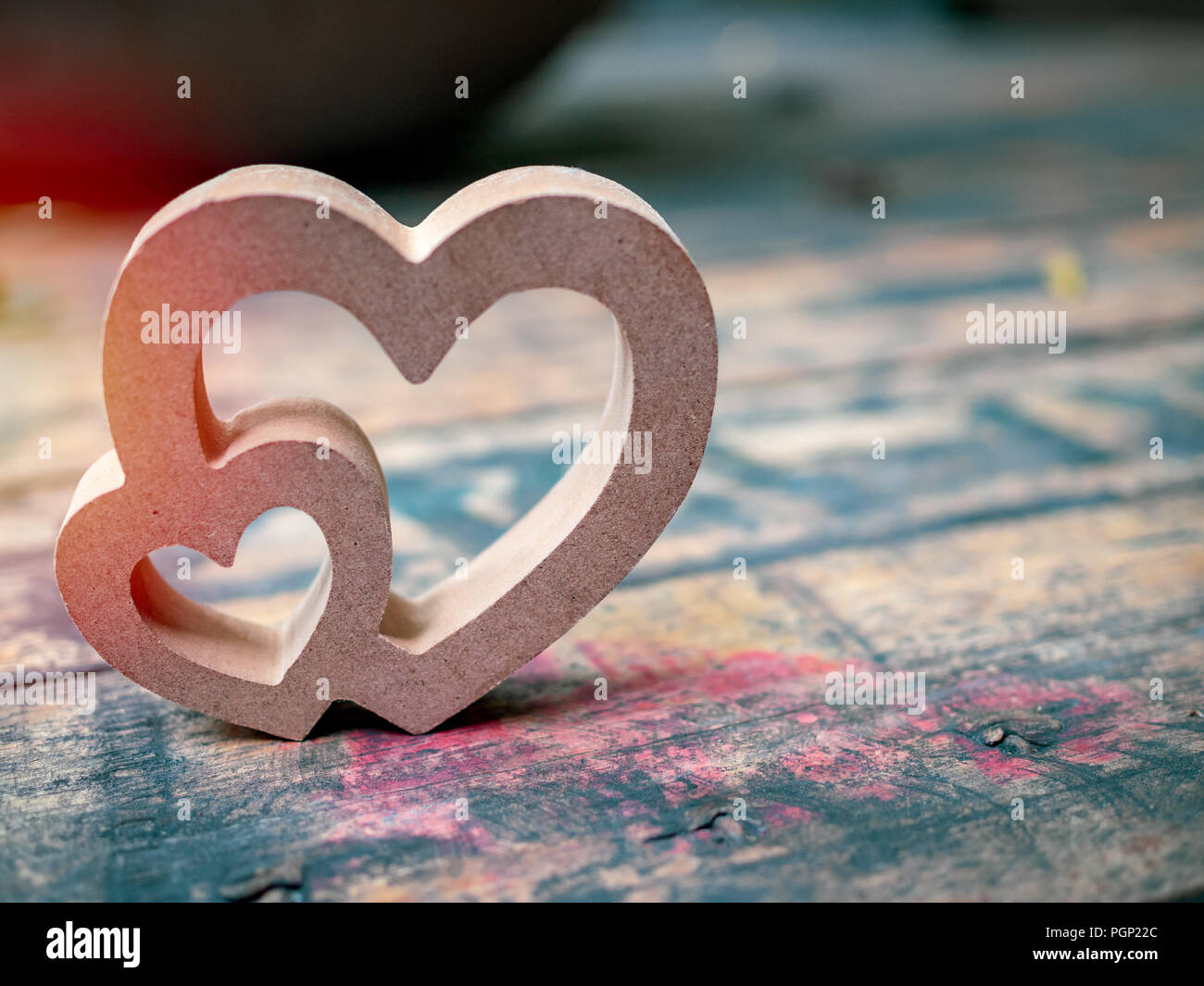 Wooden twin hearts on old wooden texture background with copy space ...