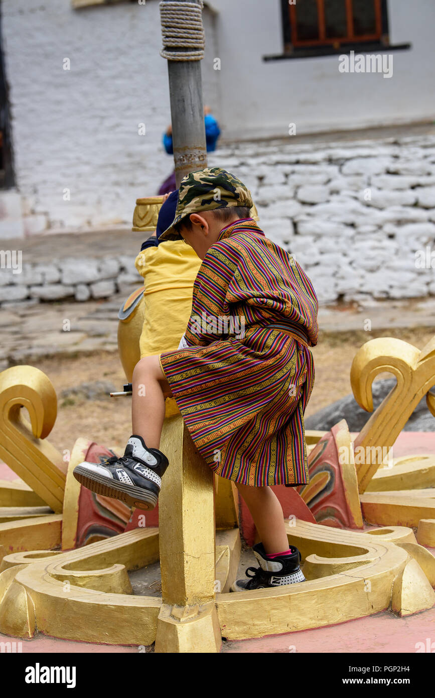 TRIMPHU, BHUTAN - MAR 8, 2017: Unidentified Ngalops little boy plays on ...