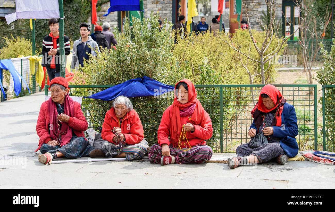 TRIMPHU, BHUTAN - MAR 8, 2017: Unidentified Ngalops people sit near the ...