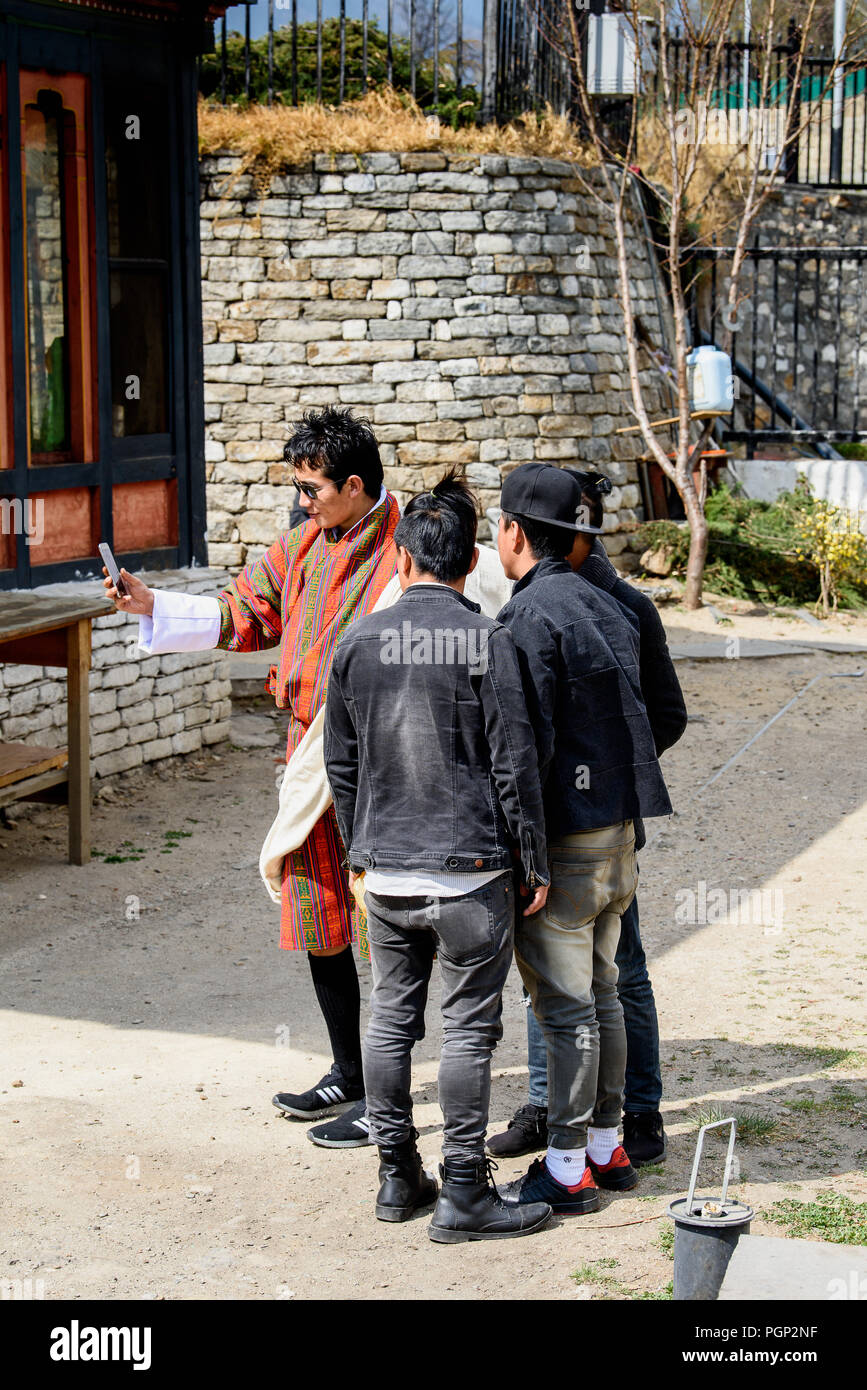 TRIMPHU, BHUTAN - MAR 8, 2017: Unidentified Ngalops people talk to each ...