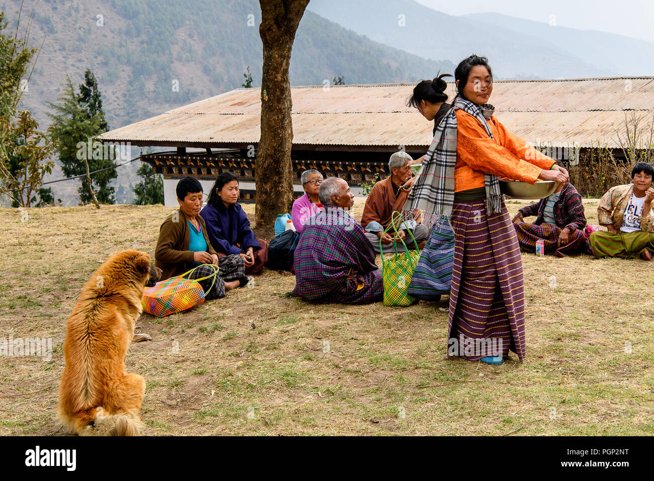 TRIMPHU, BHUTAN - MAR 8, 2017: Unidentified Ngalops people sit in a ...