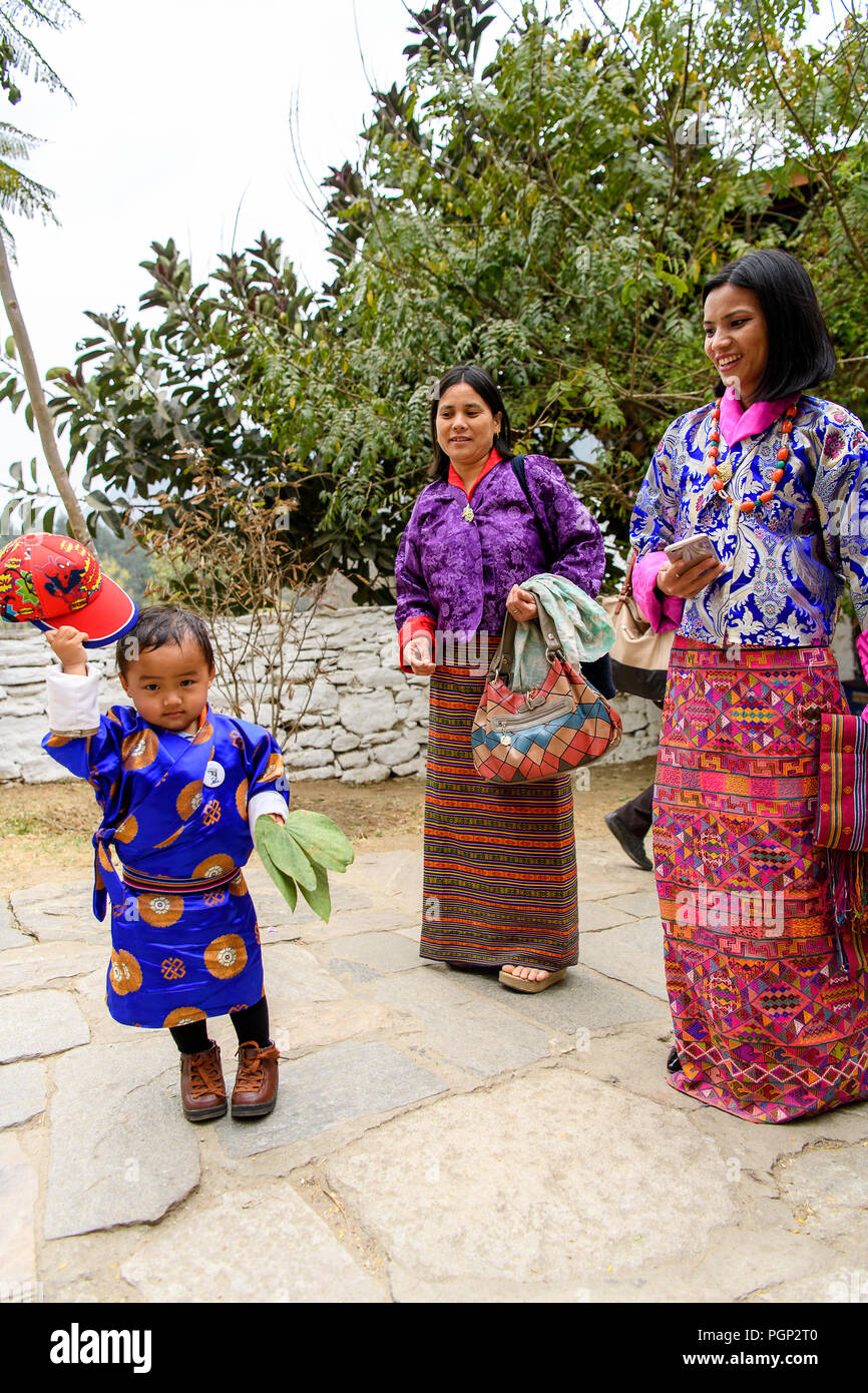 TRIMPHU, BHUTAN - MAR 8, 2017: Unidentified Ngalops women watch how the ...