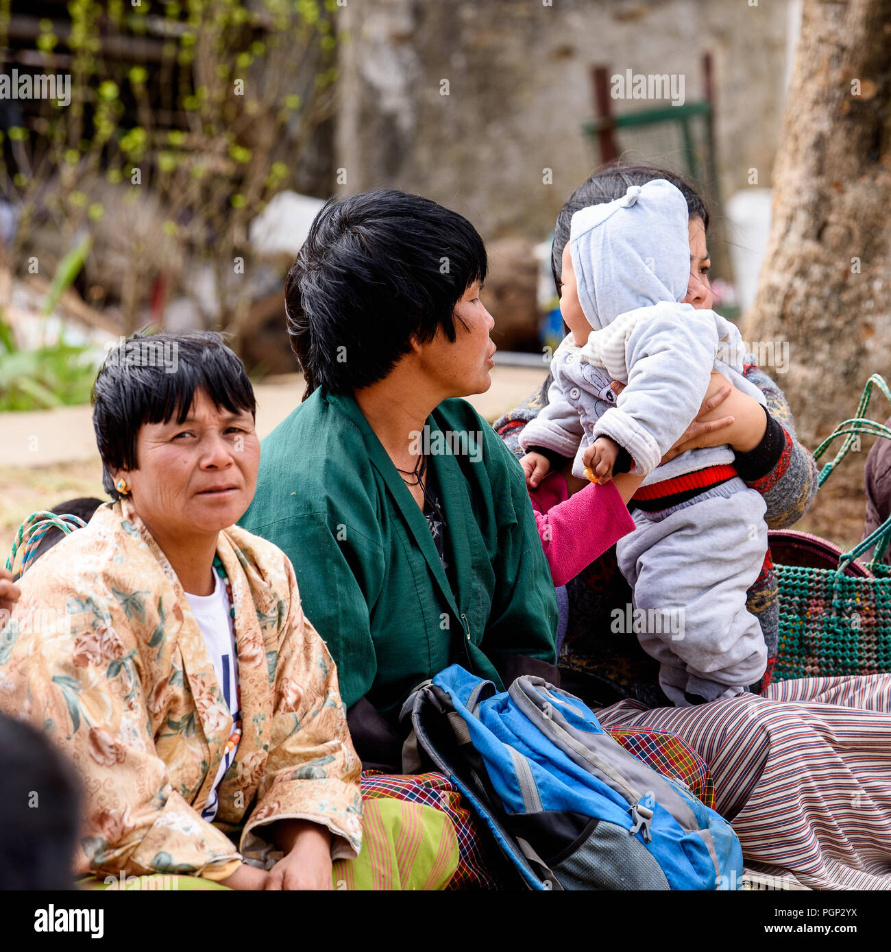TRIMPHU, BHUTAN - MAR 8, 2017: Unidentified Ngalops people sit in a ...