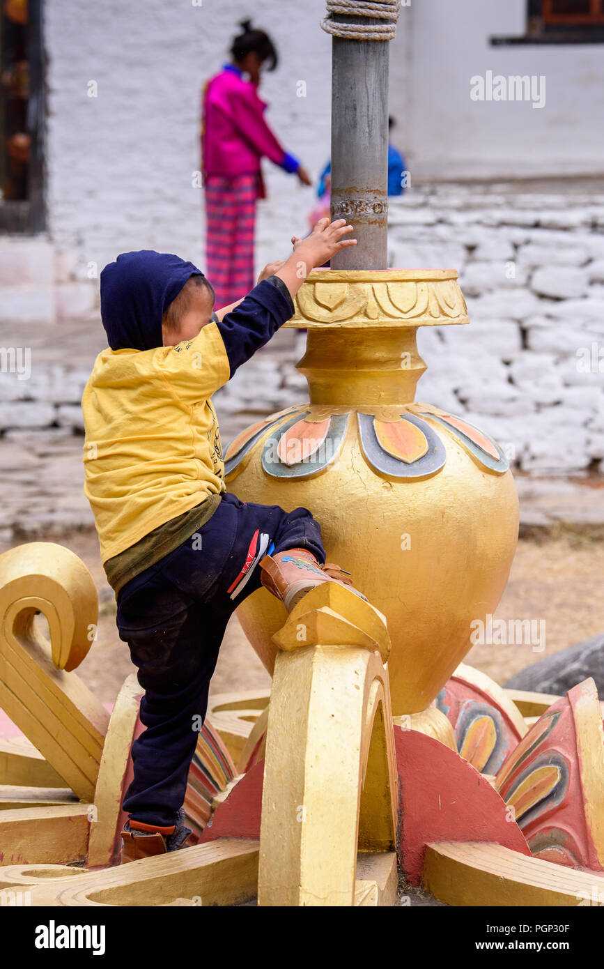 TRIMPHU, BHUTAN - MAR 8, 2017: Unidentified Ngalops little boy plays on ...