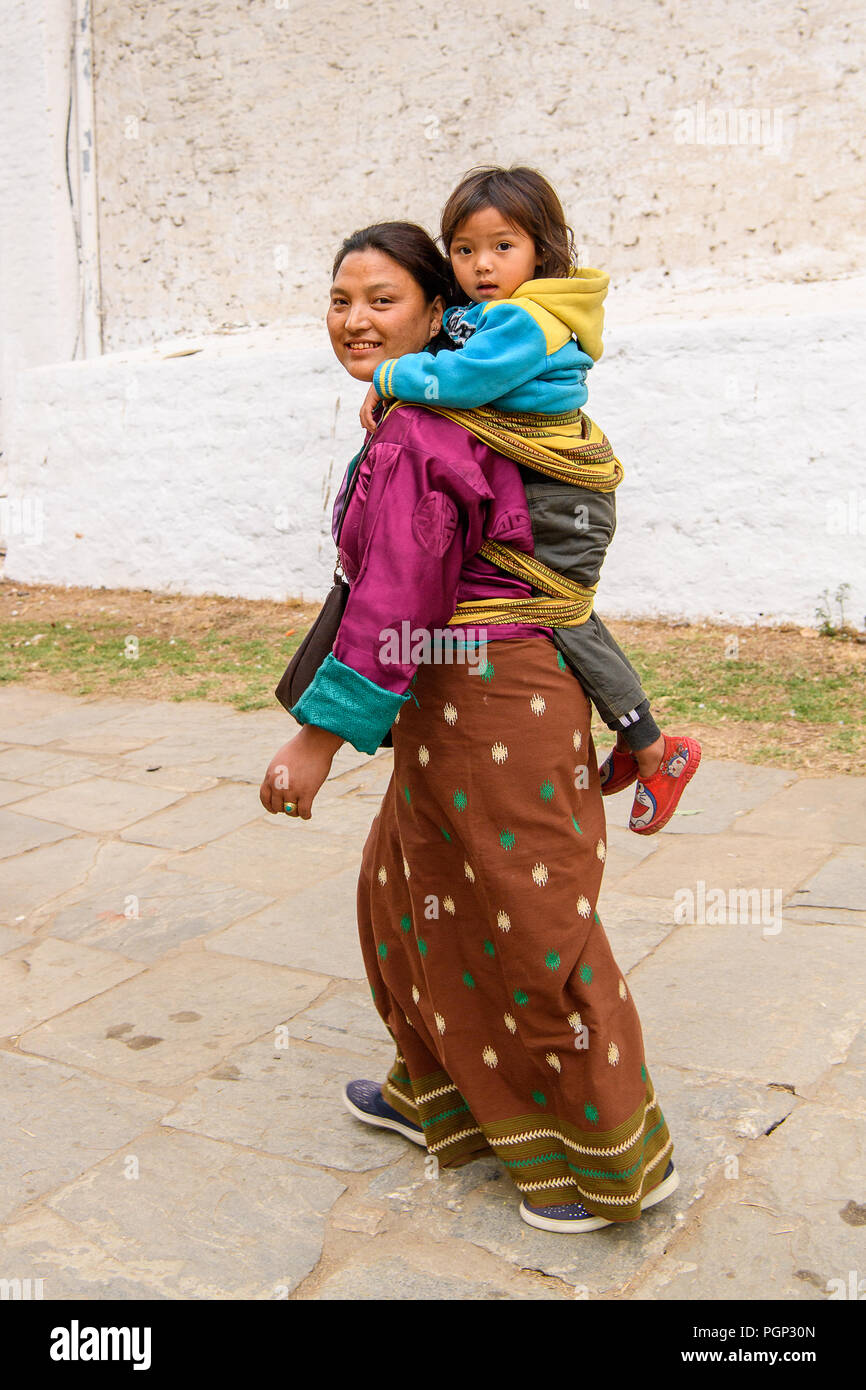 TRIMPHU, BHUTAN - MAR 8, 2017: Unidentified Ngalops woman carries a ...