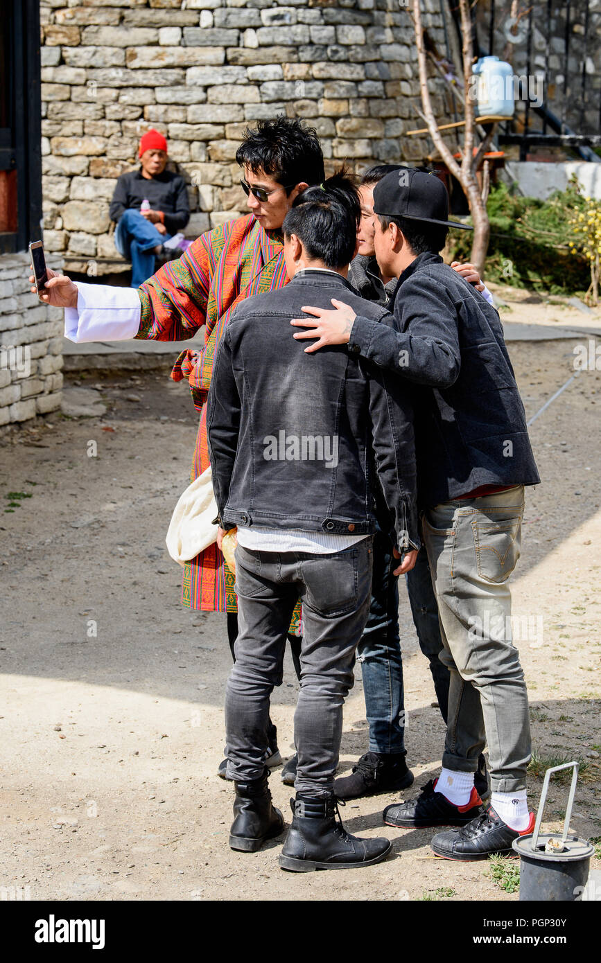 TRIMPHU, BHUTAN - MAR 8, 2017: Unidentified Ngalops people take a photo ...