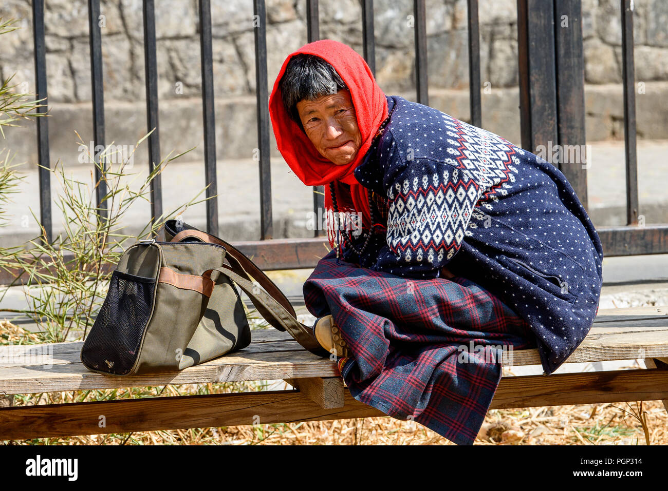 TRIMPHU, BHUTAN - MAR 8, 2017: Unidentified Ngalops old woman sits on ...