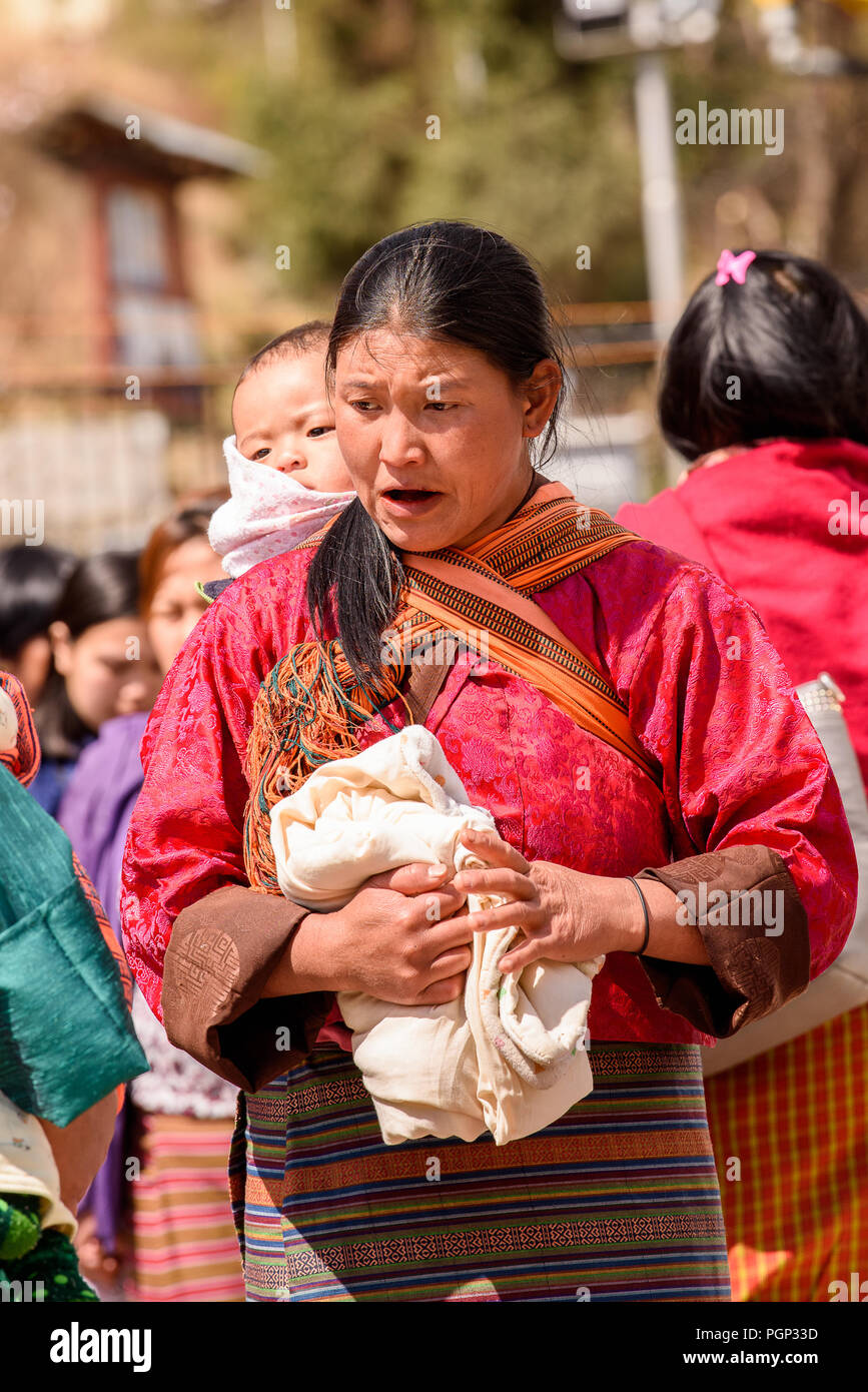 TRIMPHU, BHUTAN - MAR 8, 2017: Unidentified Ngalops woman opens her ...