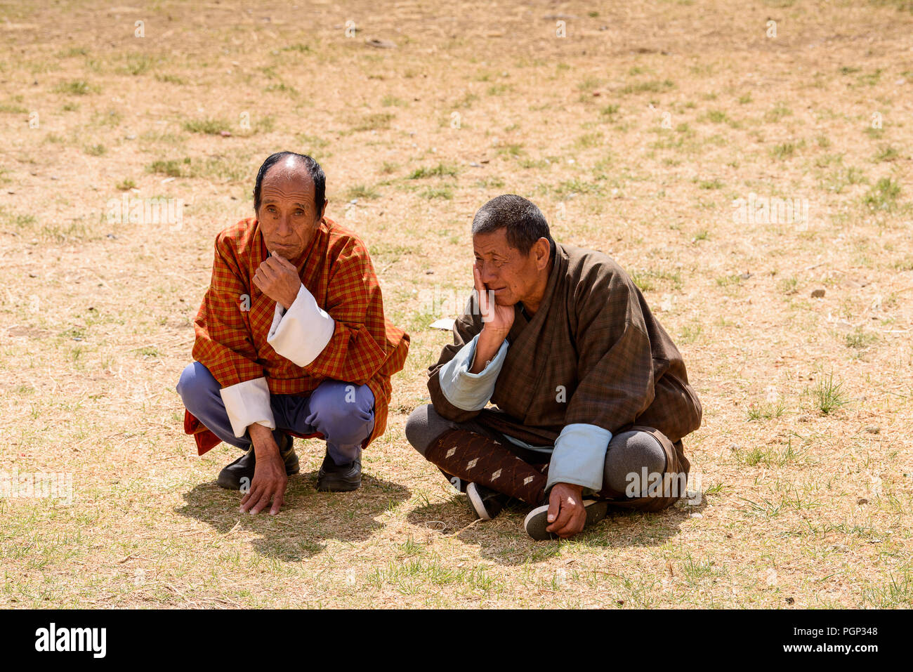 TRIMPHU, BHUTAN - MAR 8, 2017: Unidentified Ngalops two men sit on the ...