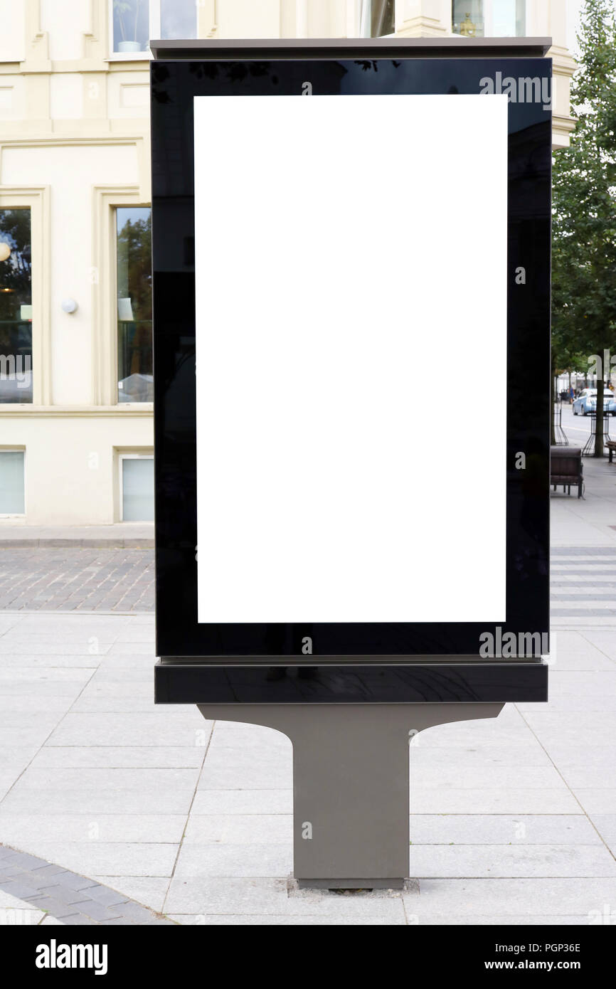 A modern empty metal advertising stand is installed on the street of ...