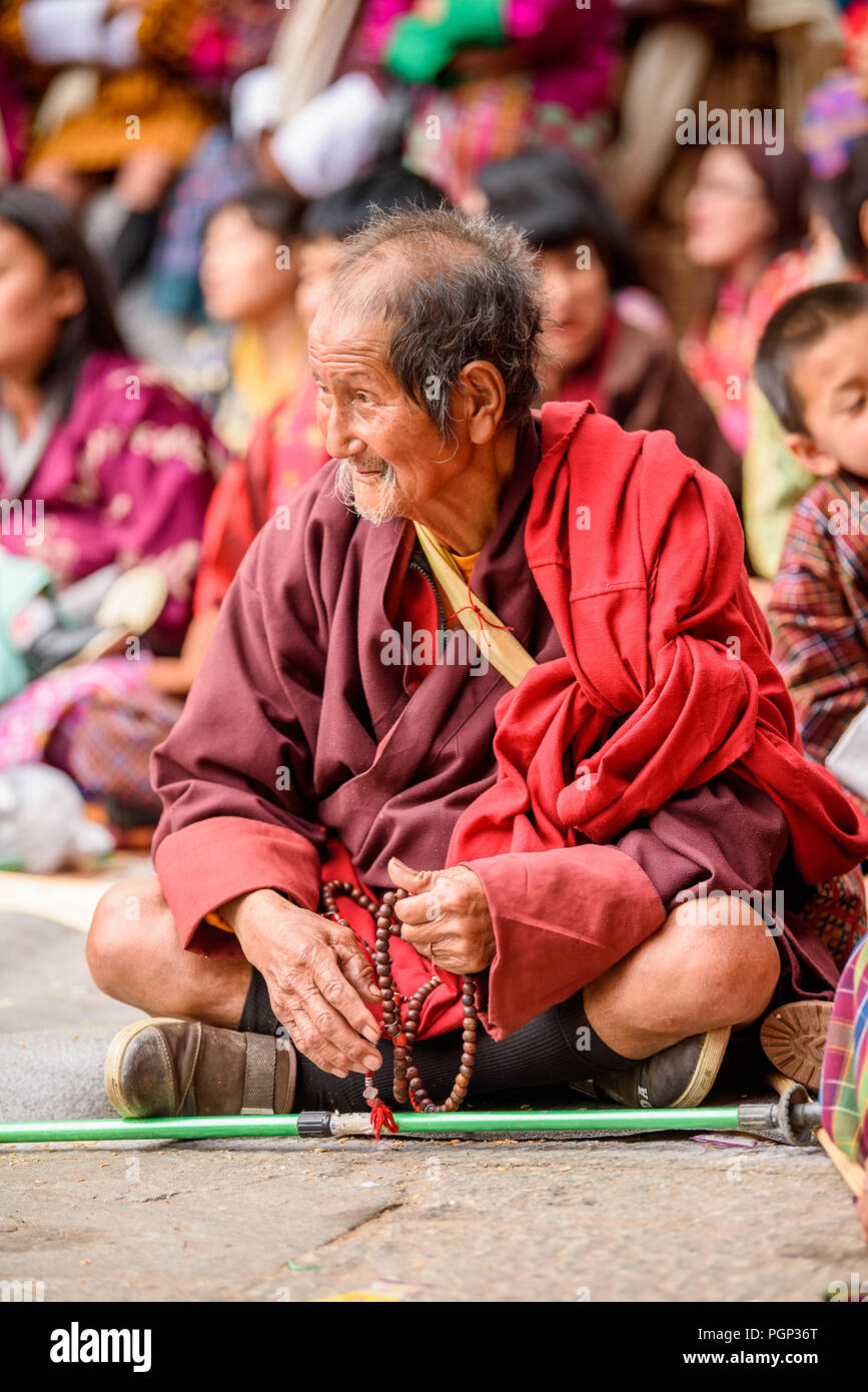 TRIMPHU, BHUTAN - MAR 8, 2017: Unidentified Ngalops old man sits on the ...