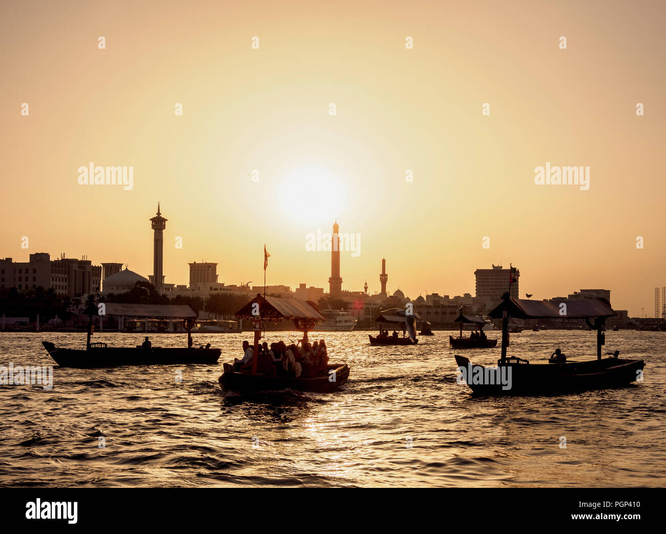 Abra Boats on Dubai Creek at sunset, Dubai, United Arab Emirates Stock ...