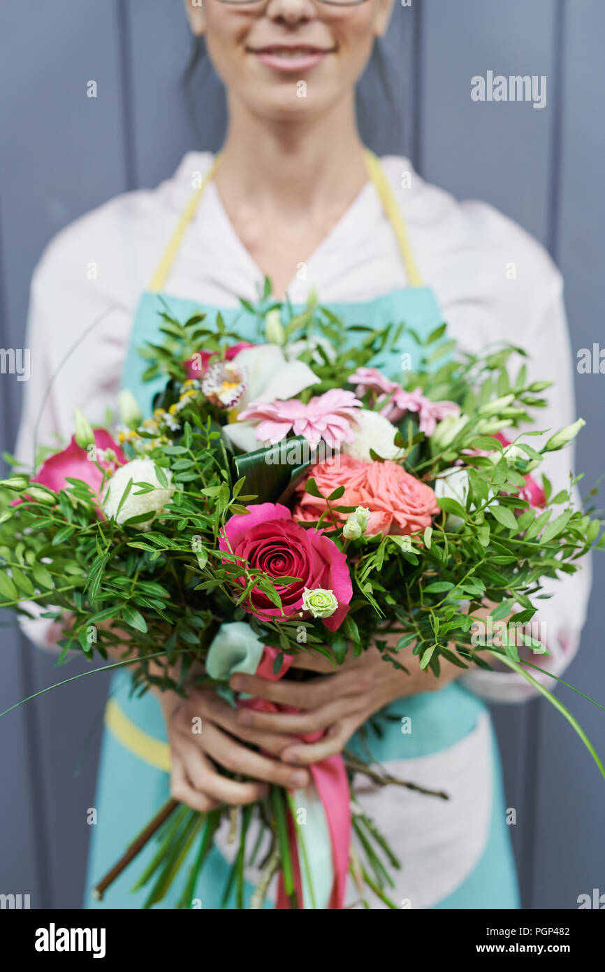 Female florist in uniform hi-res stock photography and images - Alamy