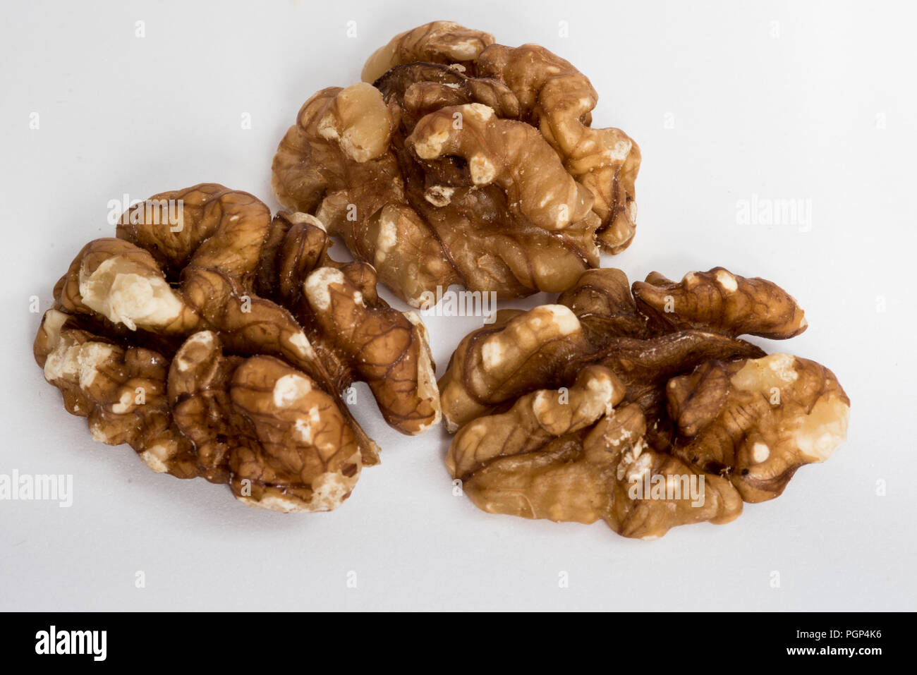 Walnut shown in depth of field on white background Stock Photo - Alamy
