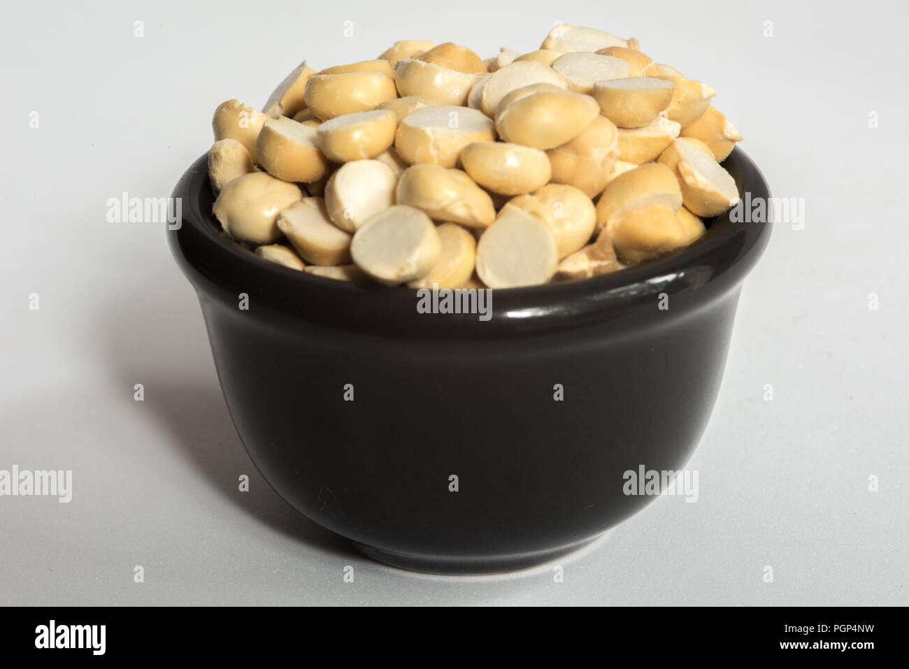 Gram dal in a black cup shown on a white background Stock Photo - Alamy