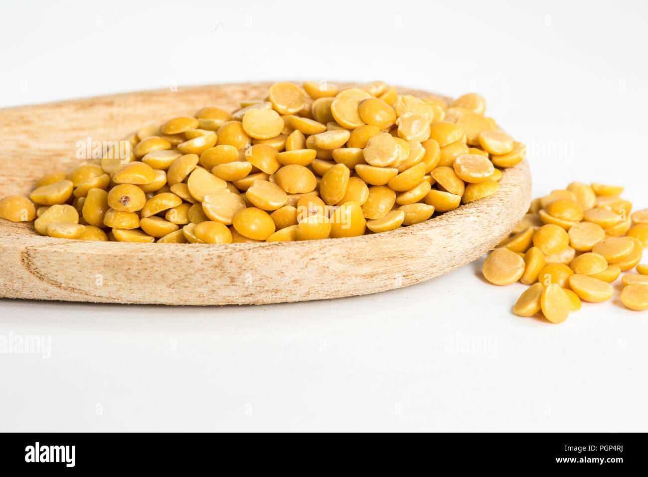 Toor dal on a wooden spatula isolated on white background Stock Photo ...