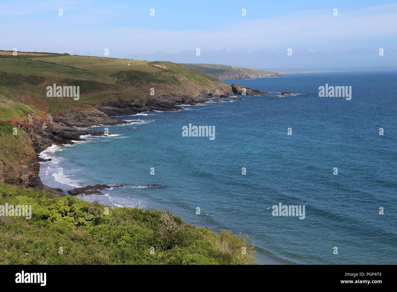 coast of Cornwall with clear blue sea in summer from the south west ...