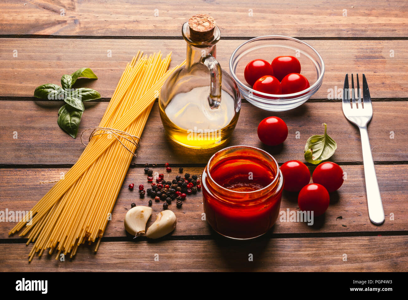 Pasta with various ingredients for cooking Italian food, on a rustic ...