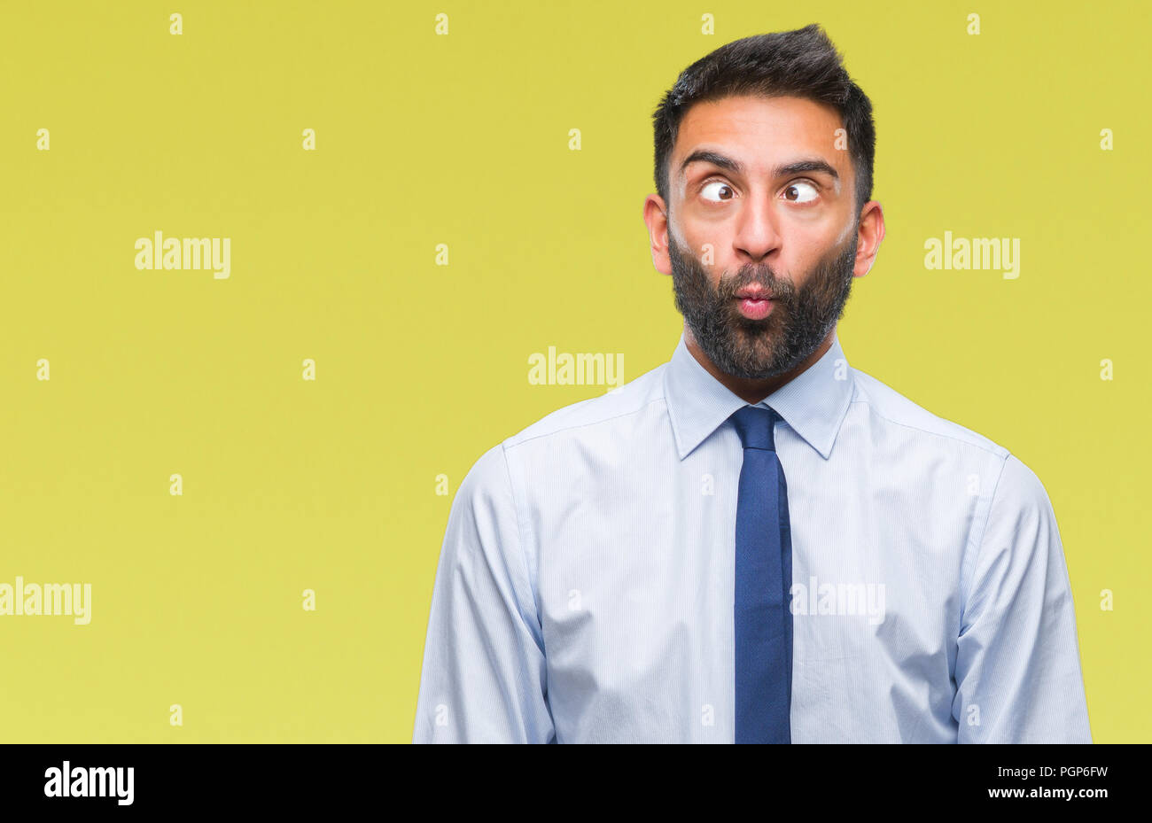 Adult hispanic business man over isolated background making fish face ...