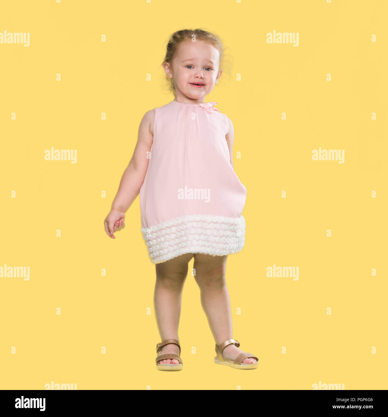 Beautiful blonde toddler gesturing Stock Photo - Alamy