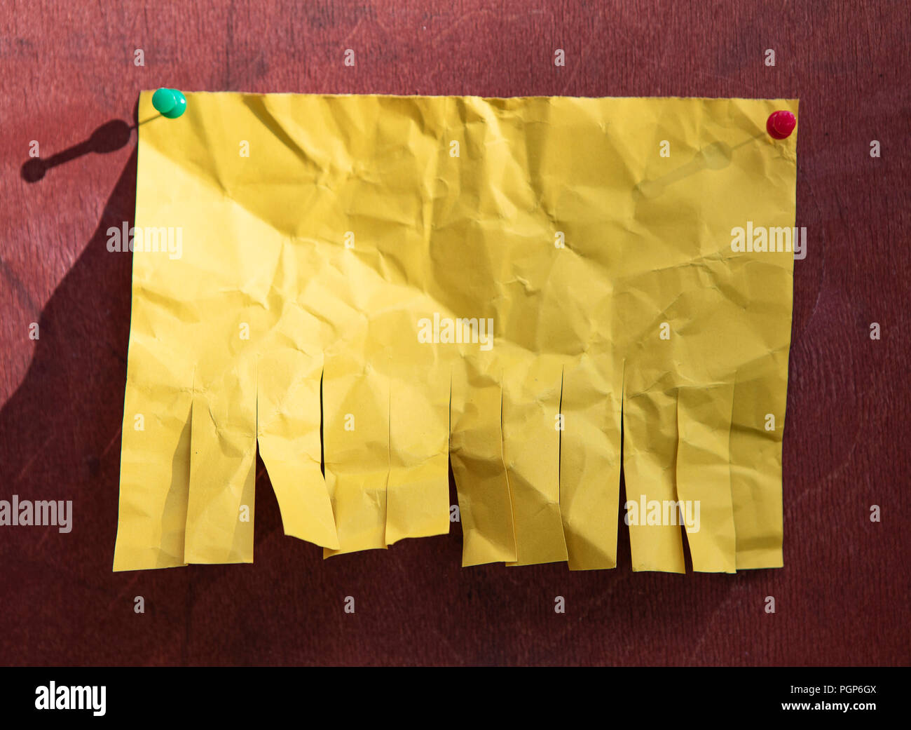 Blank yellow paper with tear off tabs Stock Photo - Alamy