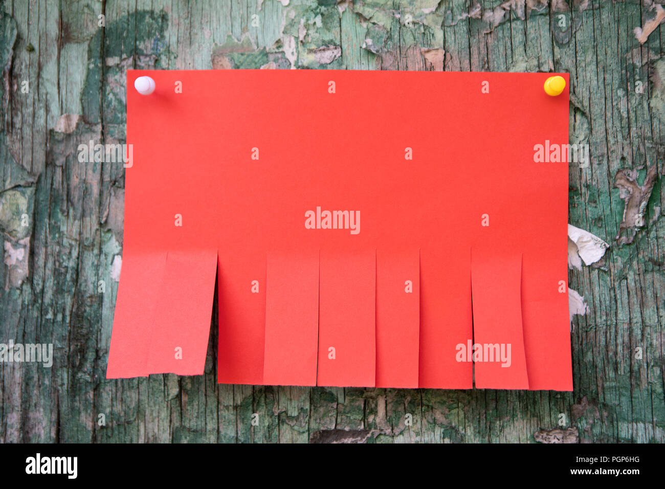 Blank red paper with tear off tabs Stock Photo - Alamy