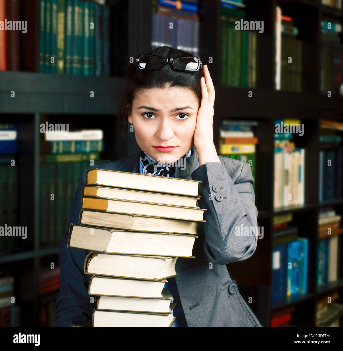 portrait of beauty young woman reading book in library smiling Stock ...