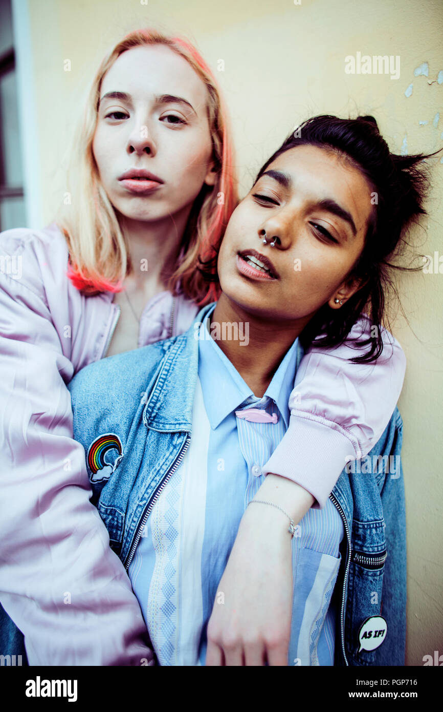 Two teenage girls infront of university building smiling, having Stock ...