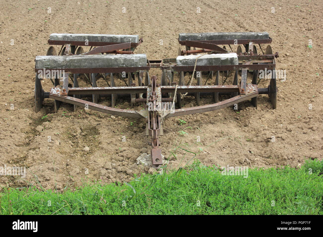 Disk harrow farm tool used for disking a farm field Stock Photo - Alamy